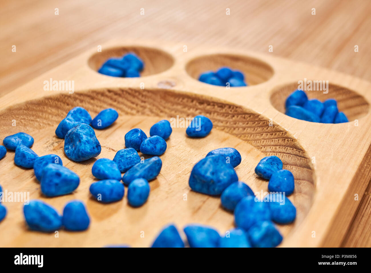 Montessori abacus for counting with wood and pebbles Stock Photo - Alamy