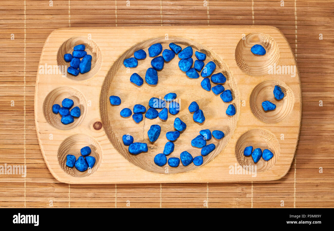 Montessori abacus for counting with wood and pebbles Stock Photo - Alamy