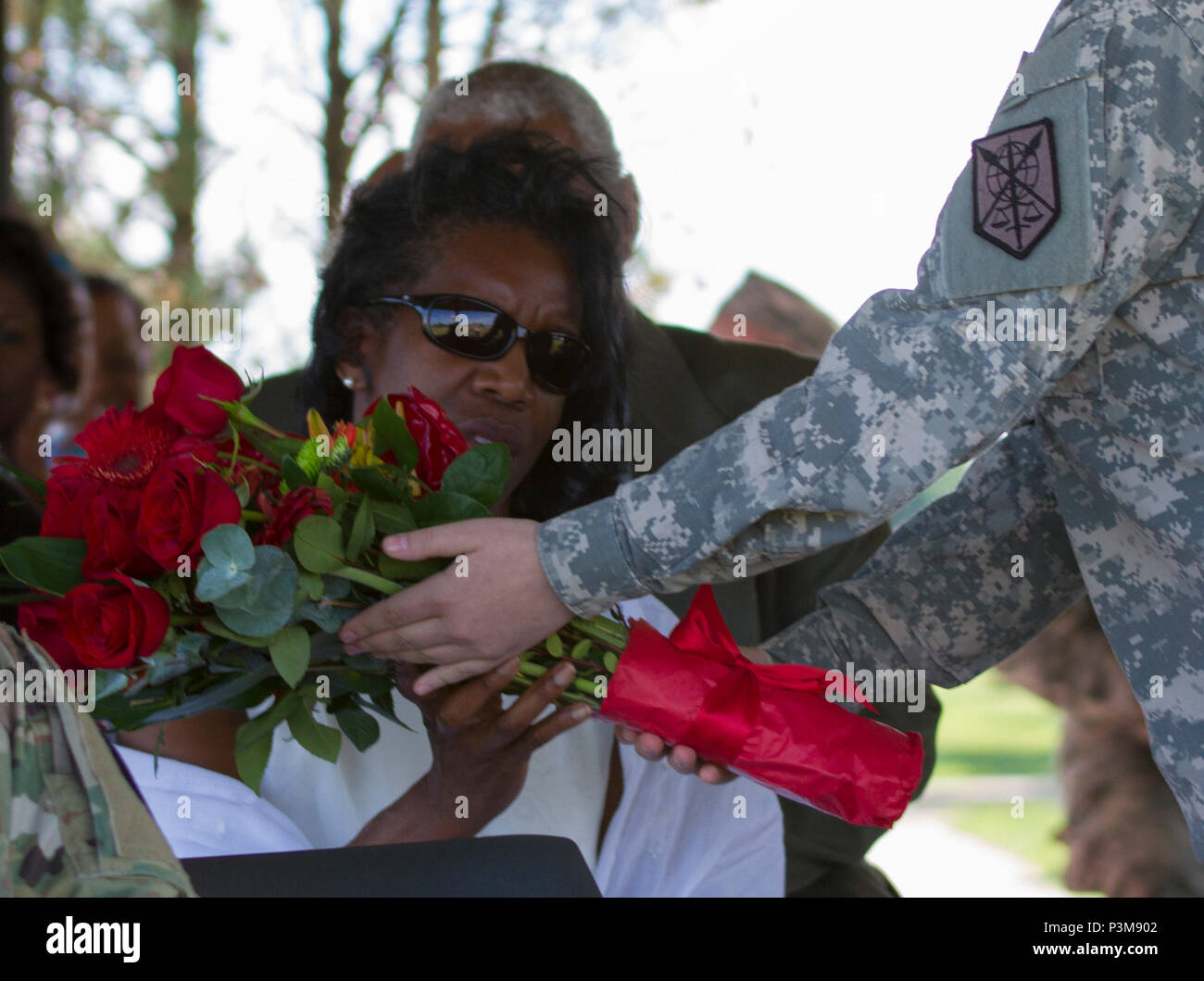 A Soldier from the 200th Military Police Command presents Robin Churn ...
