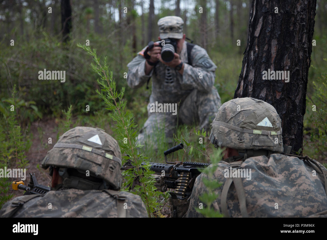 U.S. Army Spc. Michael Cox, assigned to the 982nd Combat Camera Company ...