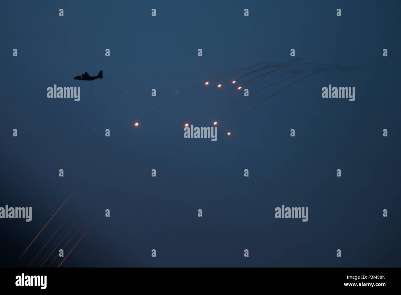 Ac-130 Gunship Firing At Night