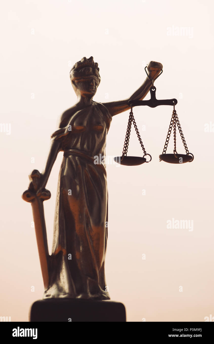 Statue of lady Justice or Justitia with scale on bright background ...