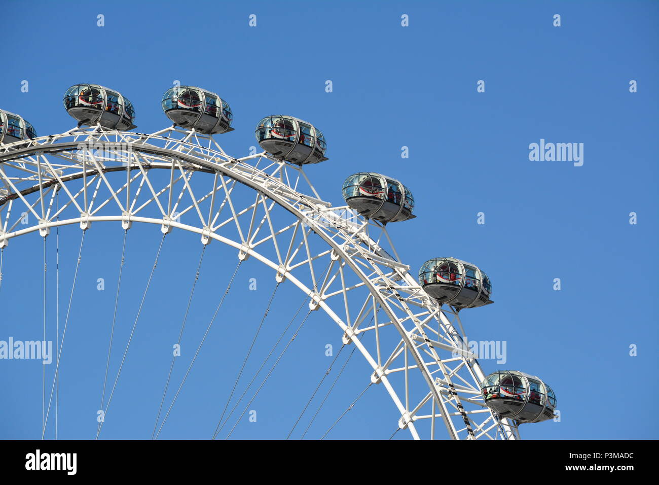 The London eye against a clear blue sky Stock Photo - Alamy