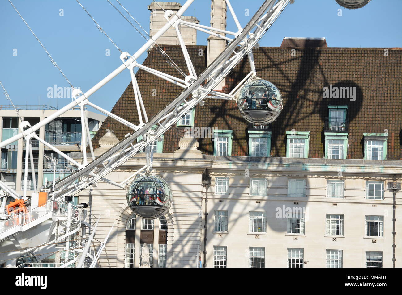The London eye against a clear blue sky Stock Photo - Alamy