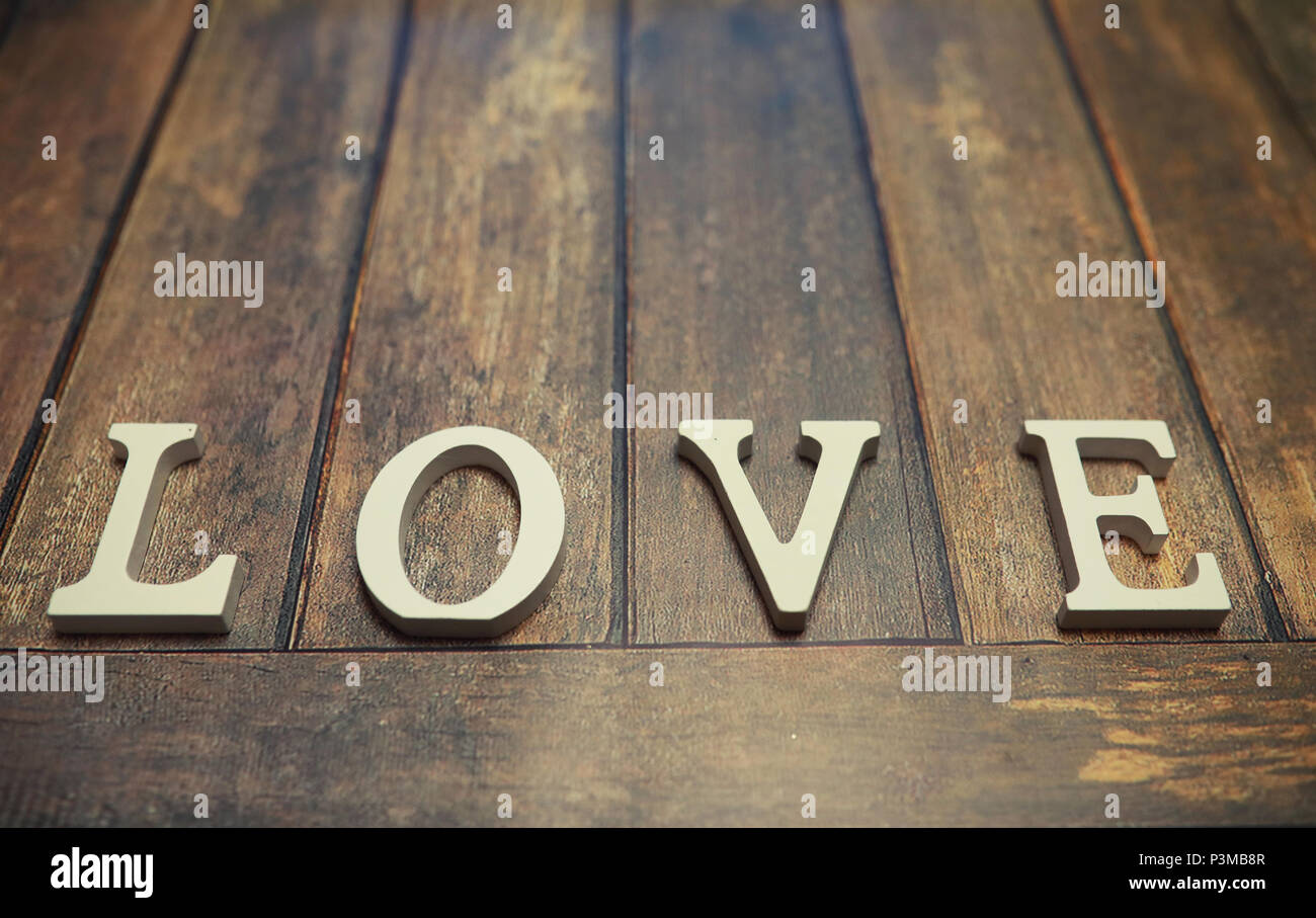 word Love from wooden letters on a wood background Stock Photo - Alamy