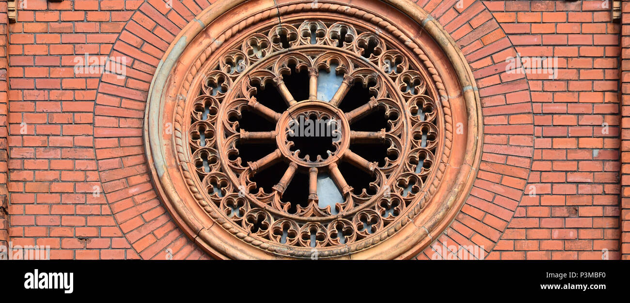 Texture front part of an ancient brick crypt with a round patterned ...