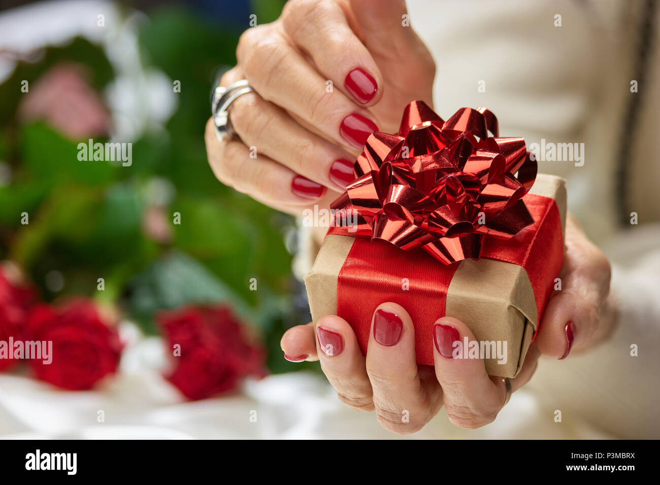 Hands opening bow hi-res stock photography and images - Alamy