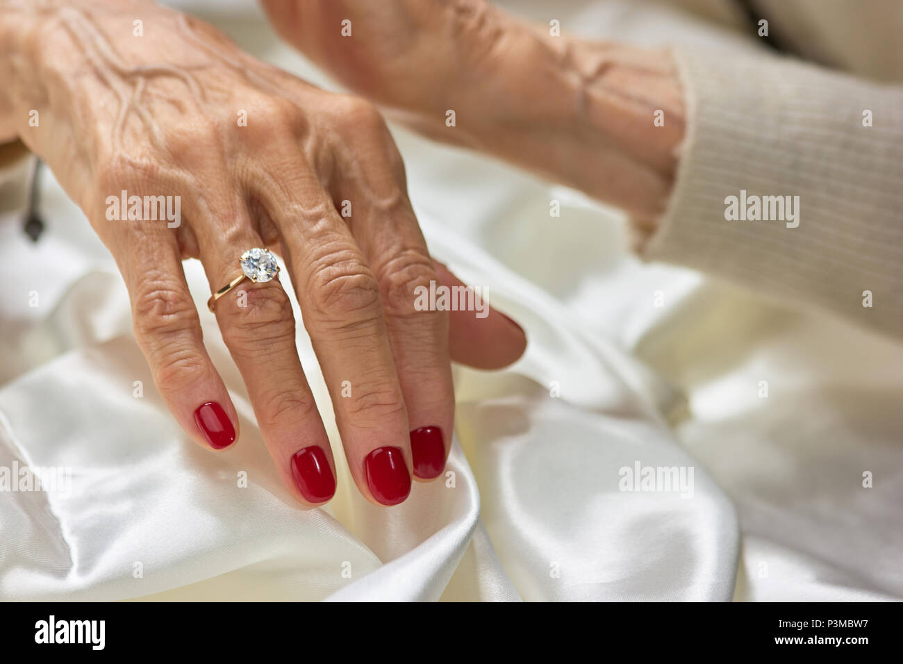 Female aged hand with diamond Stock Photo - Alamy