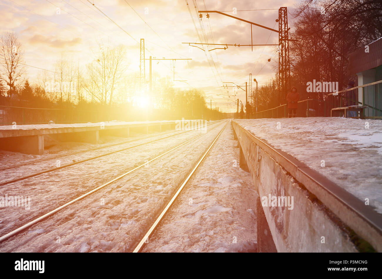 Photo of bright and beautiful sunset on a cloudy sky in cold winter ...