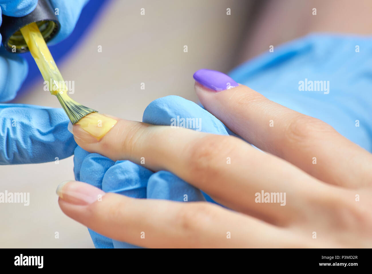 Applying nail painting hi-res stock photography and images - Alamy