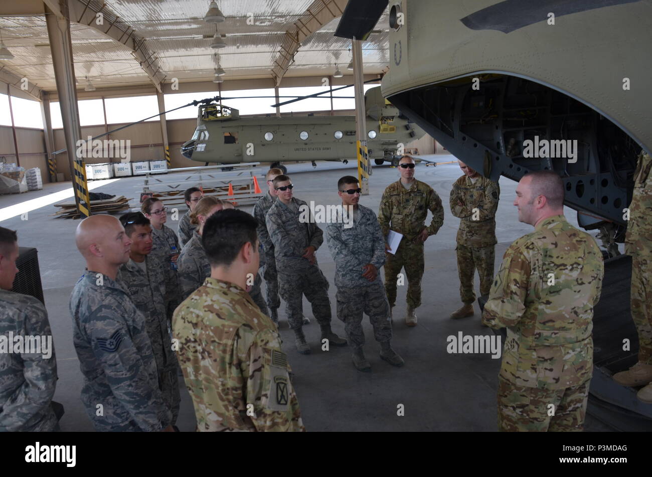 Air Force Academy cadets talk with Army helicopter pilots while ...