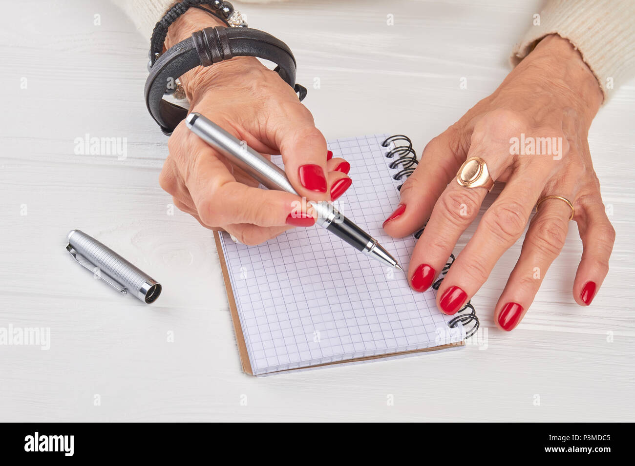 Old woman manicured hands with pen Stock Photo - Alamy