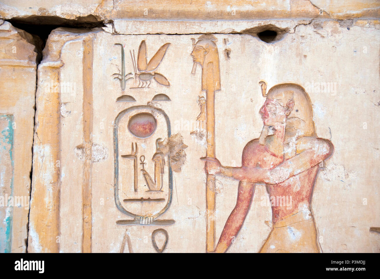 Colorfully painted bas relief stone carvings at the Great Osiris Temple ...