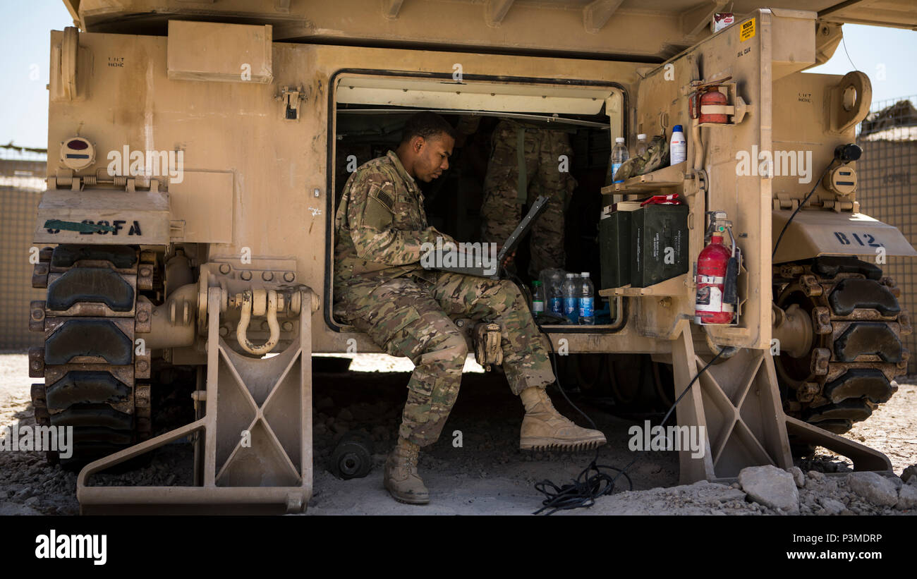 U.S. Army Sgt. Michael Wilkins, artillery mechanic with Battery C, 4th ...