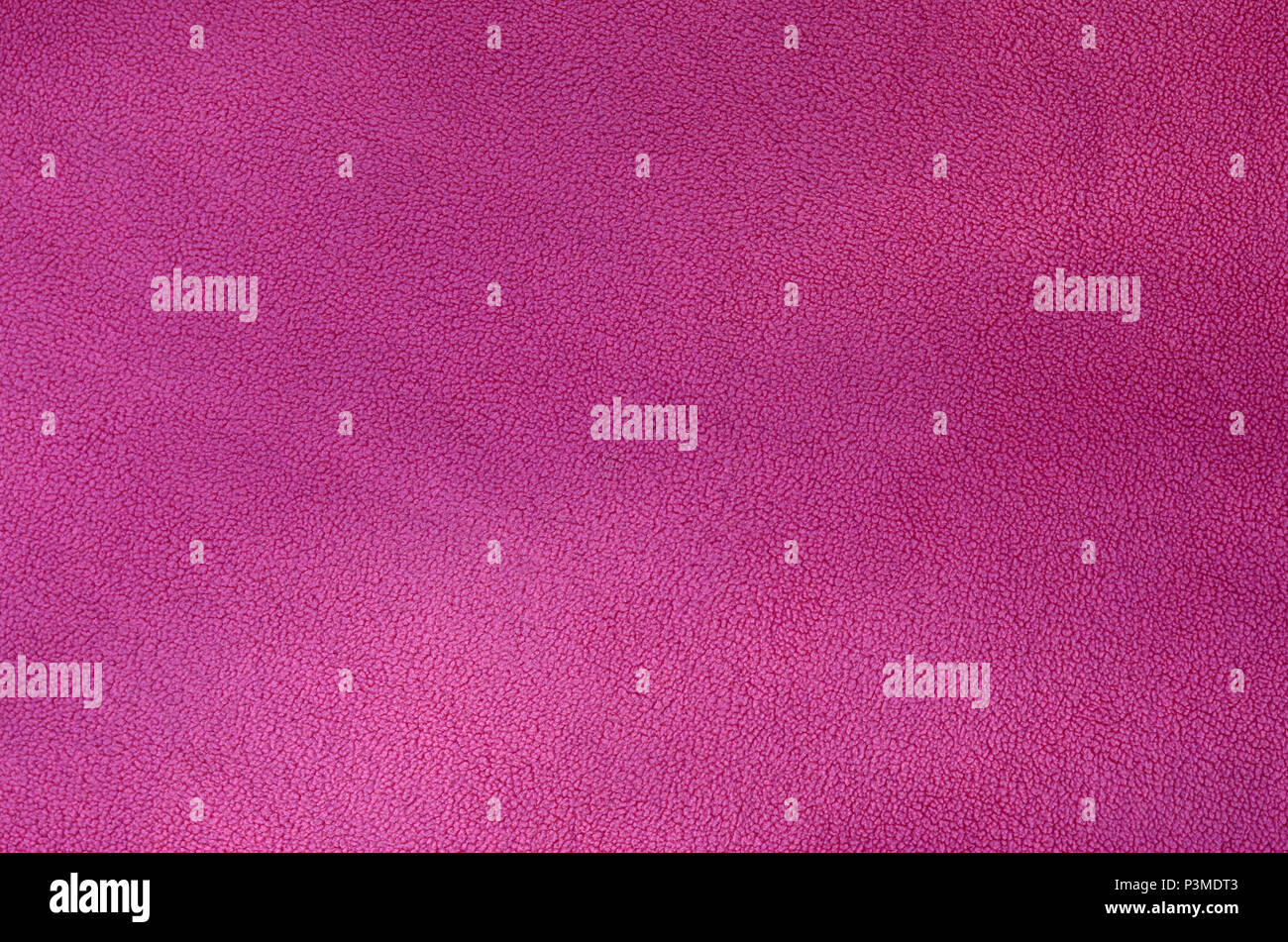 The blanket of furry pink fleece fabric. A background texture of light ...