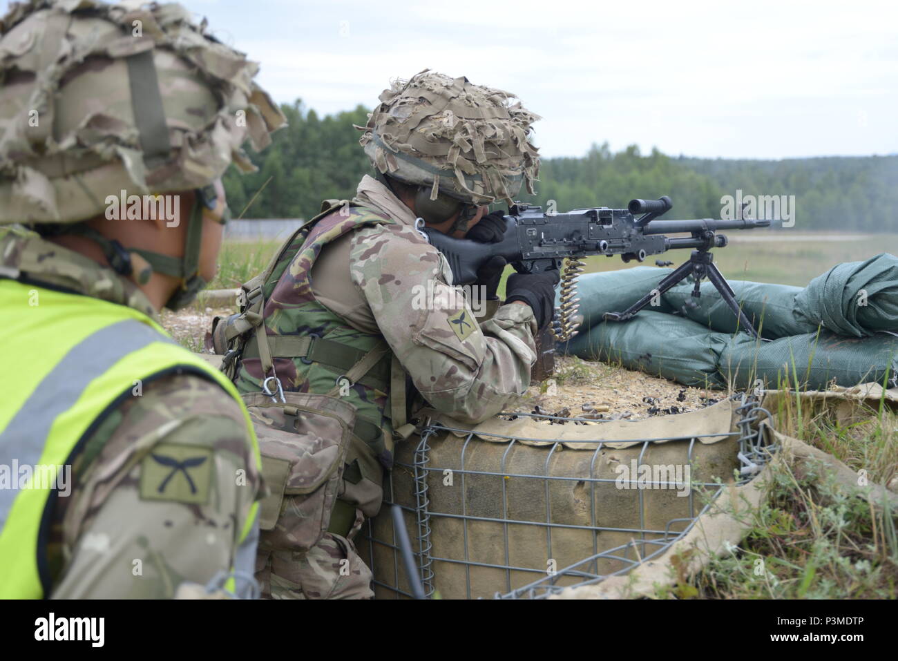 A British Army Royal Military Academy Sandhurst cadet fires his 7.62mm ...