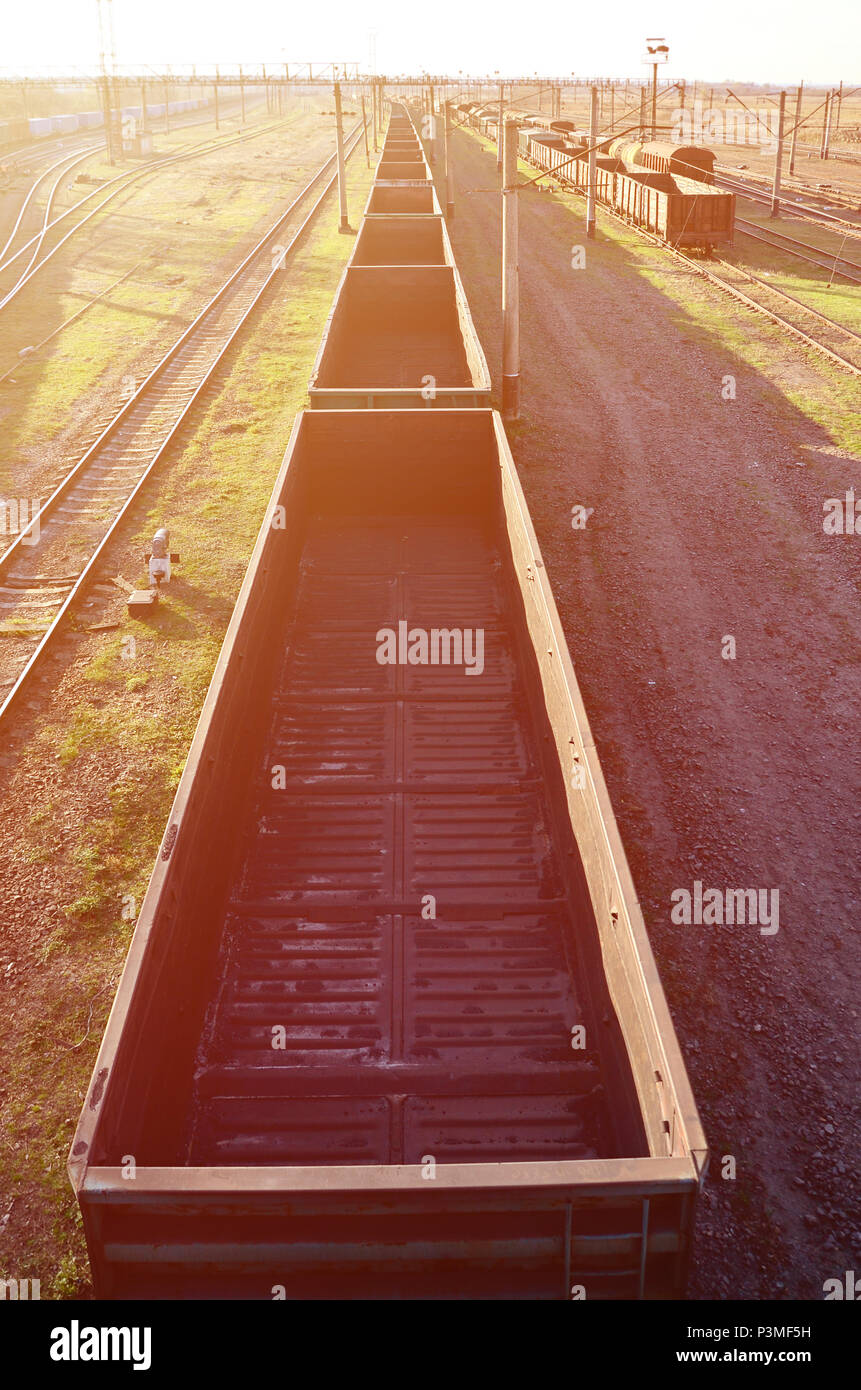 Railway landscape with many old railroad freight cars on the rails ...