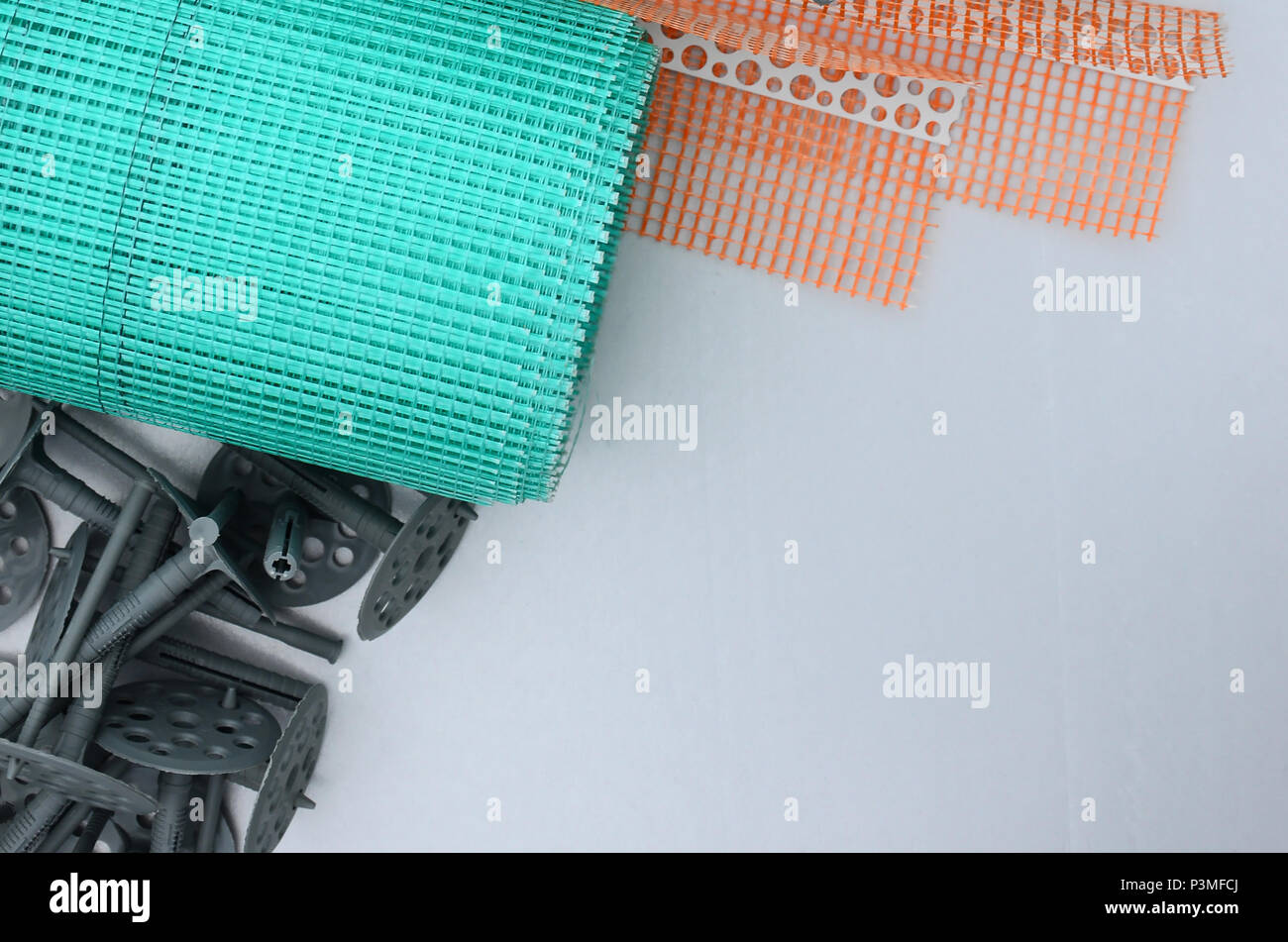 A set of construction items for the insulation of walls. Plastic dowels ...