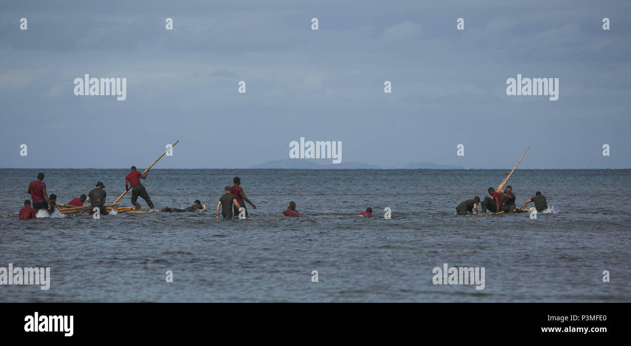 U.S. Marines and Fijian Soldiers test out their bamboo rafts by racing ...