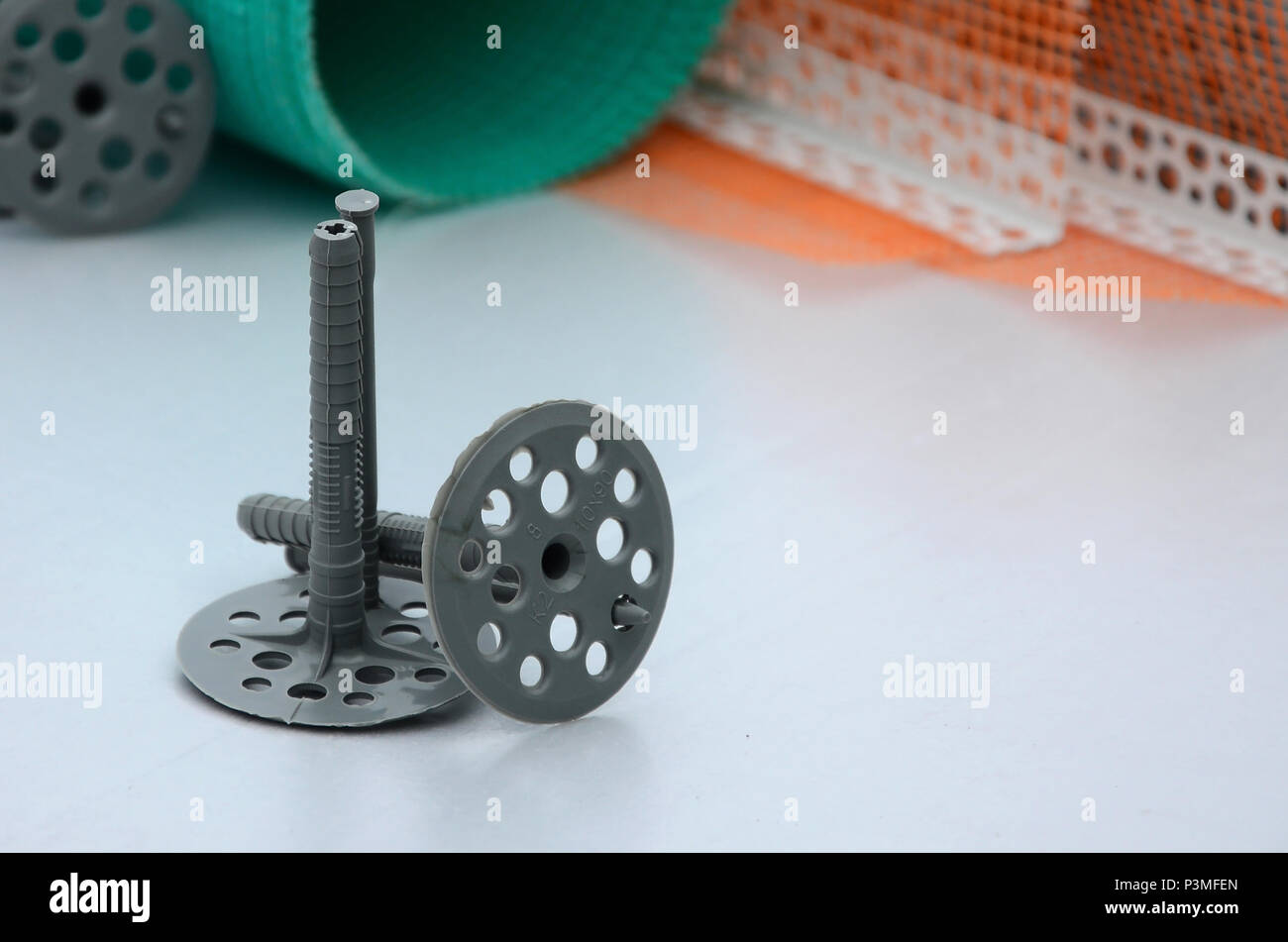 A set of construction items for the insulation of walls. Plastic dowels ...