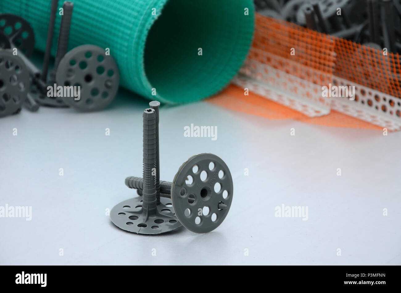 A set of construction items for the insulation of walls. Plastic dowels ...