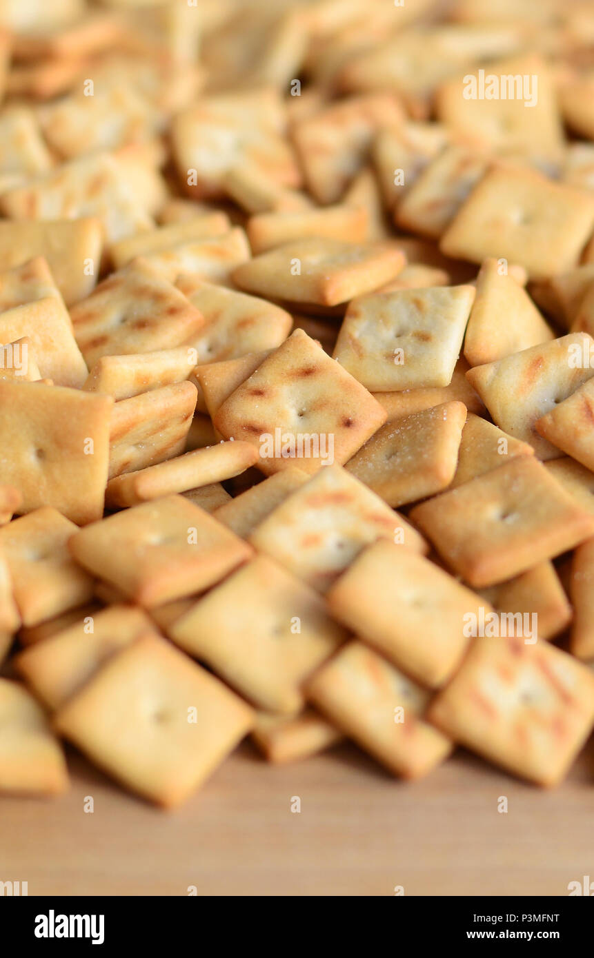 Background texture of small edible squares baked from dough and ...