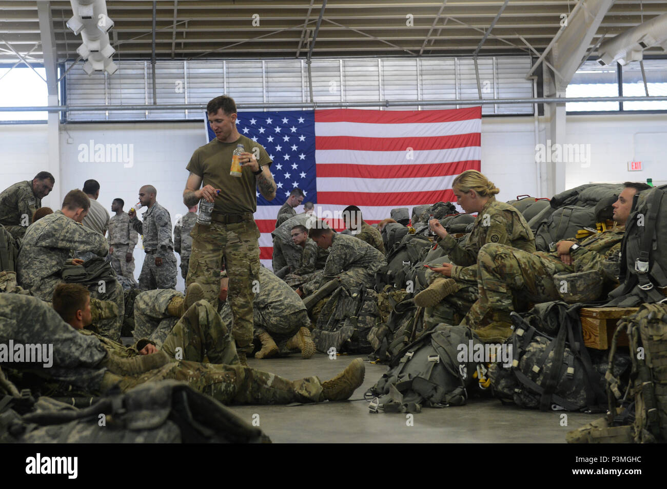 U.S. Army members from the 82nd Airborne Division wait to perform ...