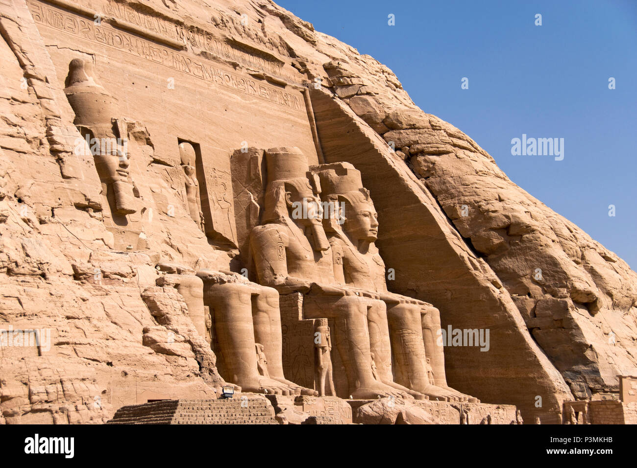 Colossal statues of pharaoh Rameses II decorate the facade of the Great ...
