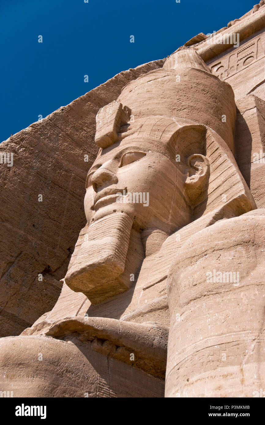 Colossal statues of pharaoh Rameses II decorate the facade of the Great ...