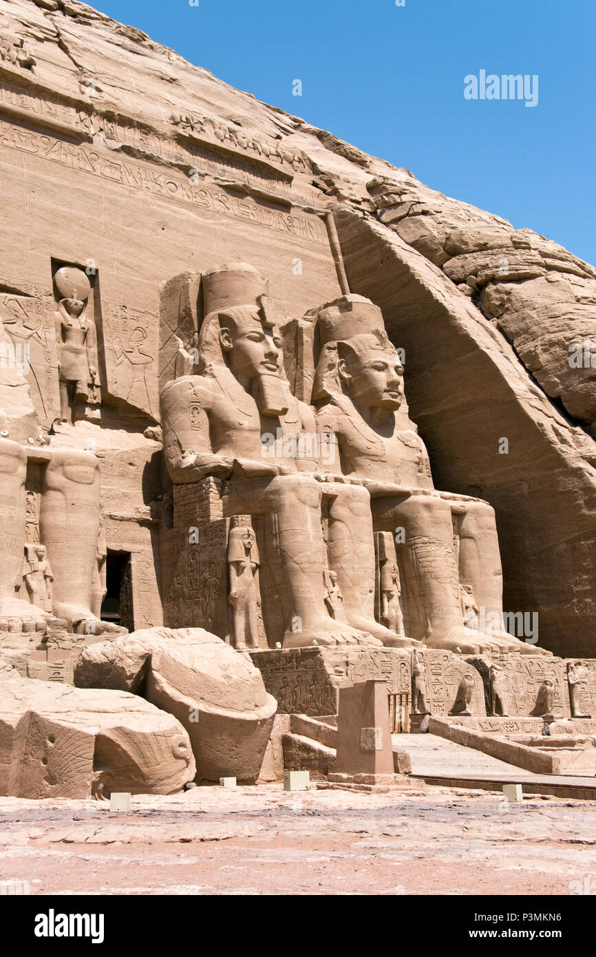 Colossal statues of pharaoh Rameses II decorate the facade of the Great ...
