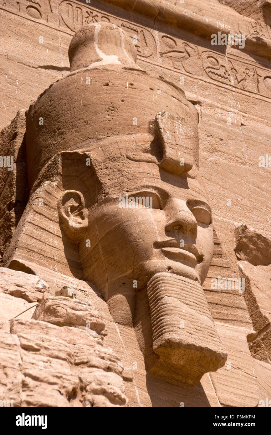 Colossal statues of pharaoh Rameses II decorate the facade of the Great ...