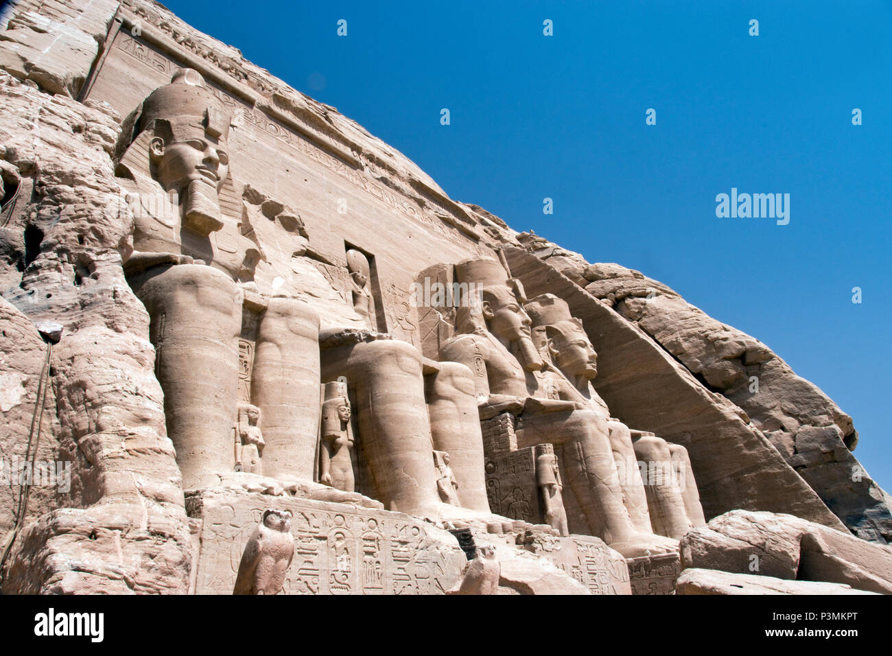 Colossal statues of pharaoh Rameses II decorate the facade of the Great ...