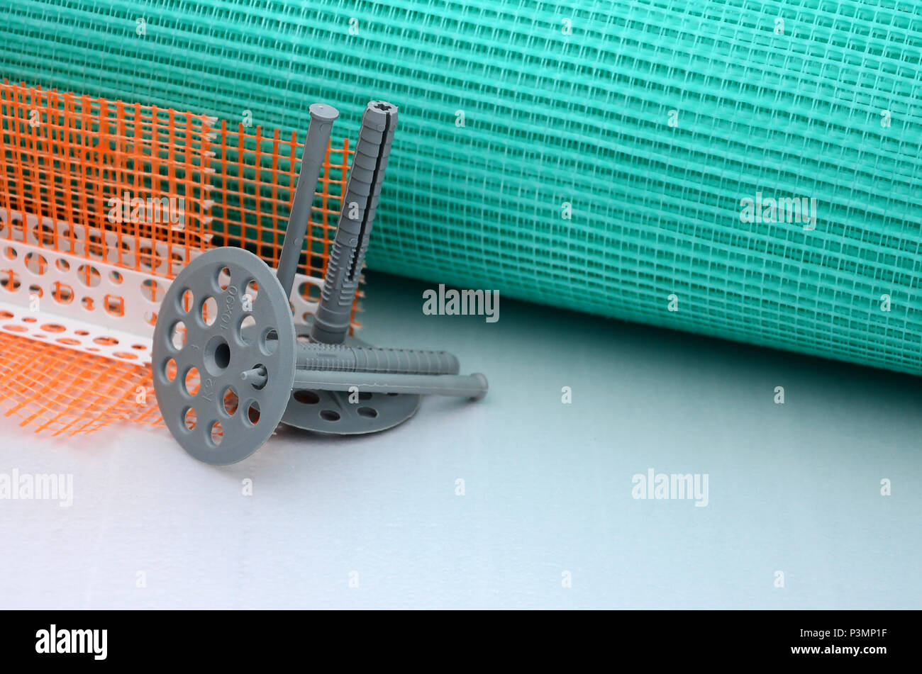 A set of construction items for the insulation of walls. Plastic dowels ...