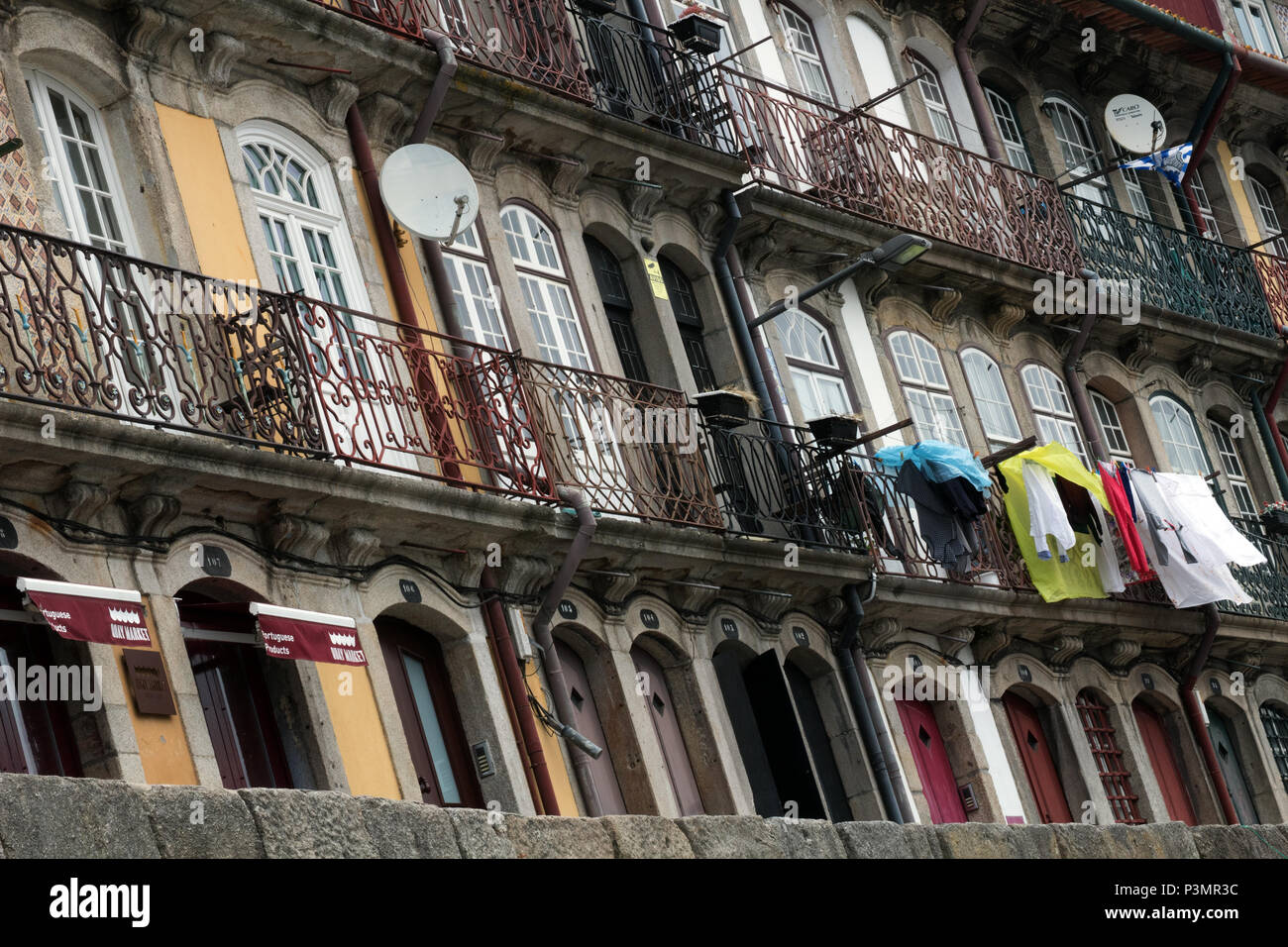 Windows and balconies on terraced buildings on the Ribiera waterfront ...