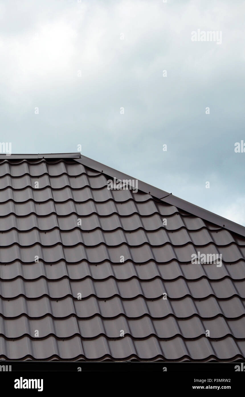 Brown roof tiles or shingles on house as background image. New ...