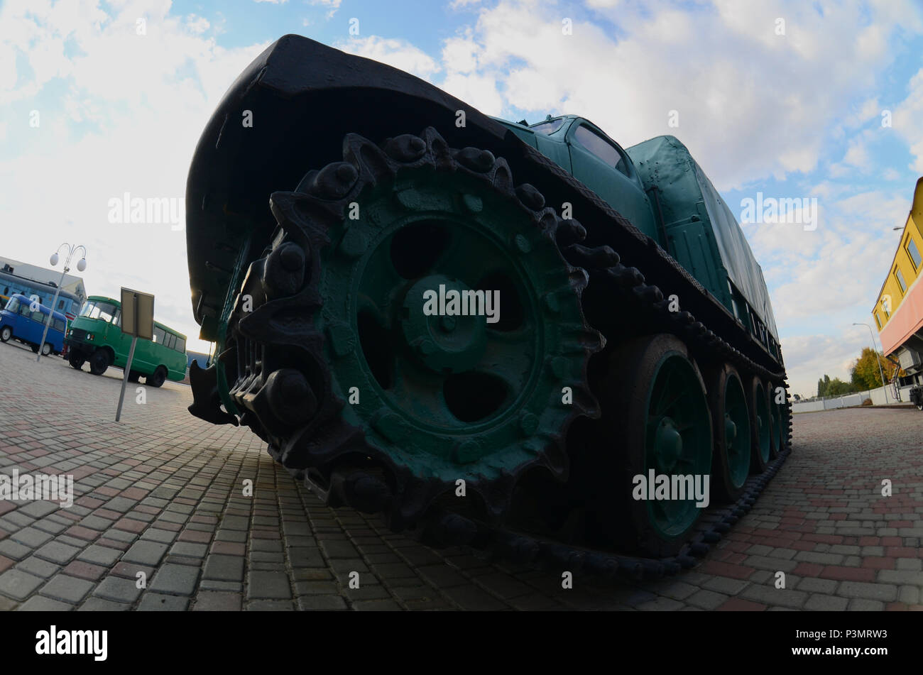 Photo of a Russian green armored car on a caterpillar track among the ...