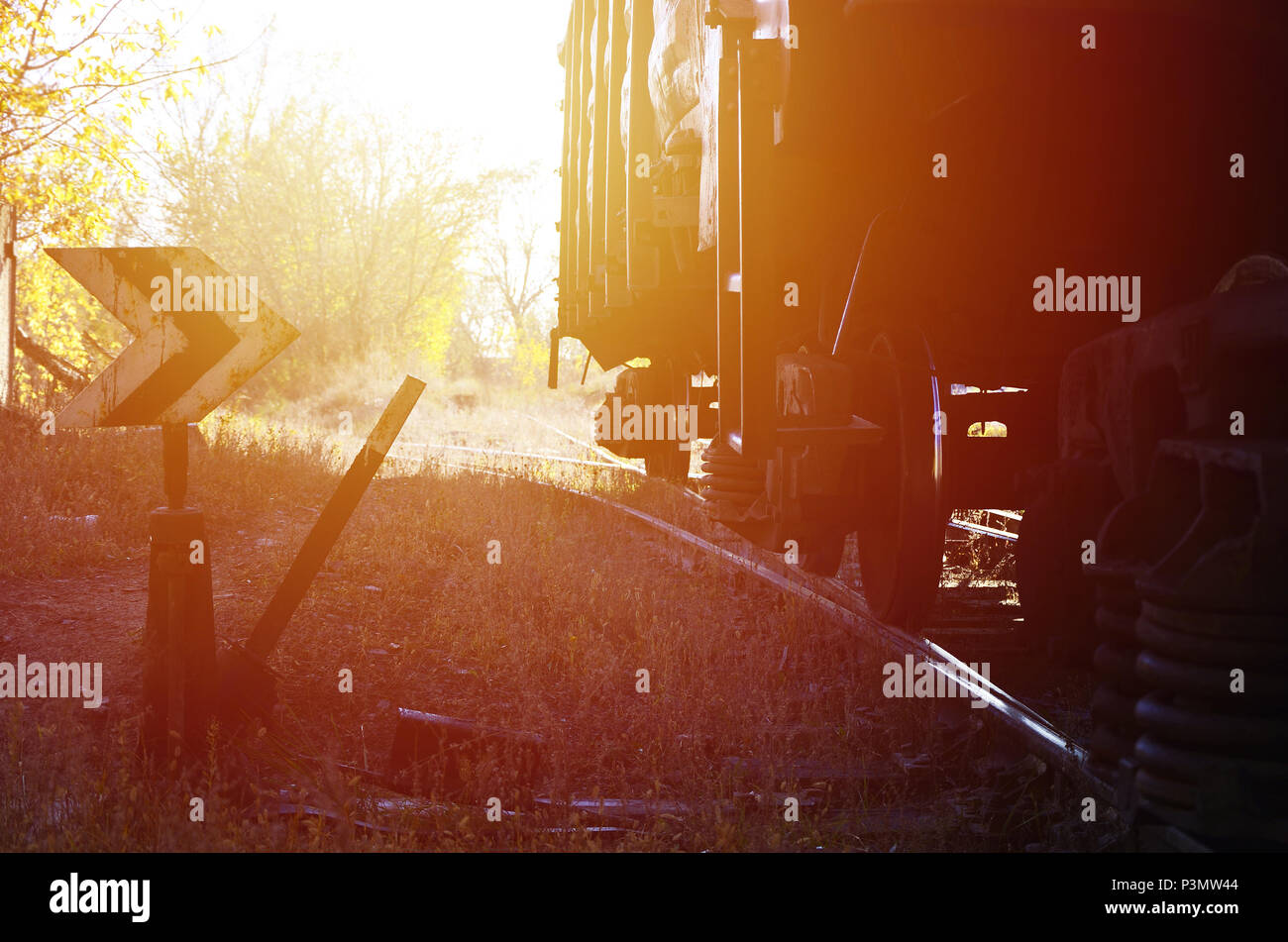Railway landscape.Railroad track switcher under the railcar dark shadow ...