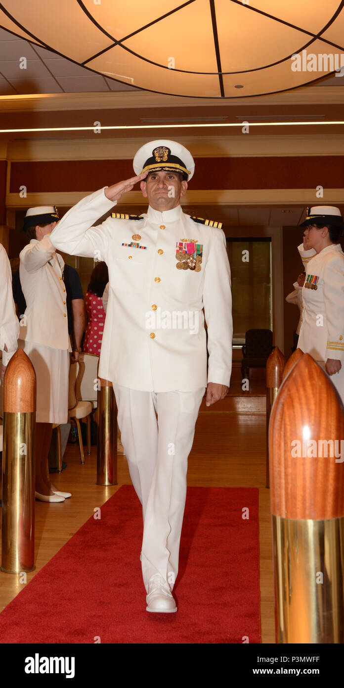 Side boys render honors to Capt. Rick Freedman as he departs from the ...