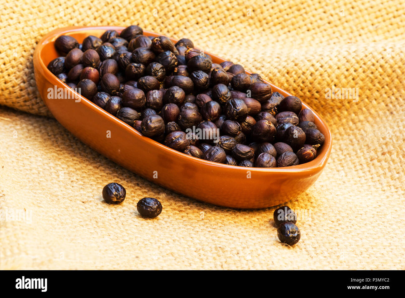 Dried coffee berries in a bowl on burlap Stock Photo - Alamy