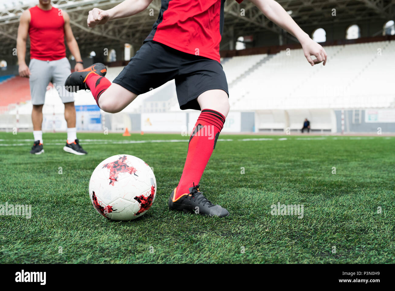 Team action kicking ball hi-res stock photography and images - Alamy