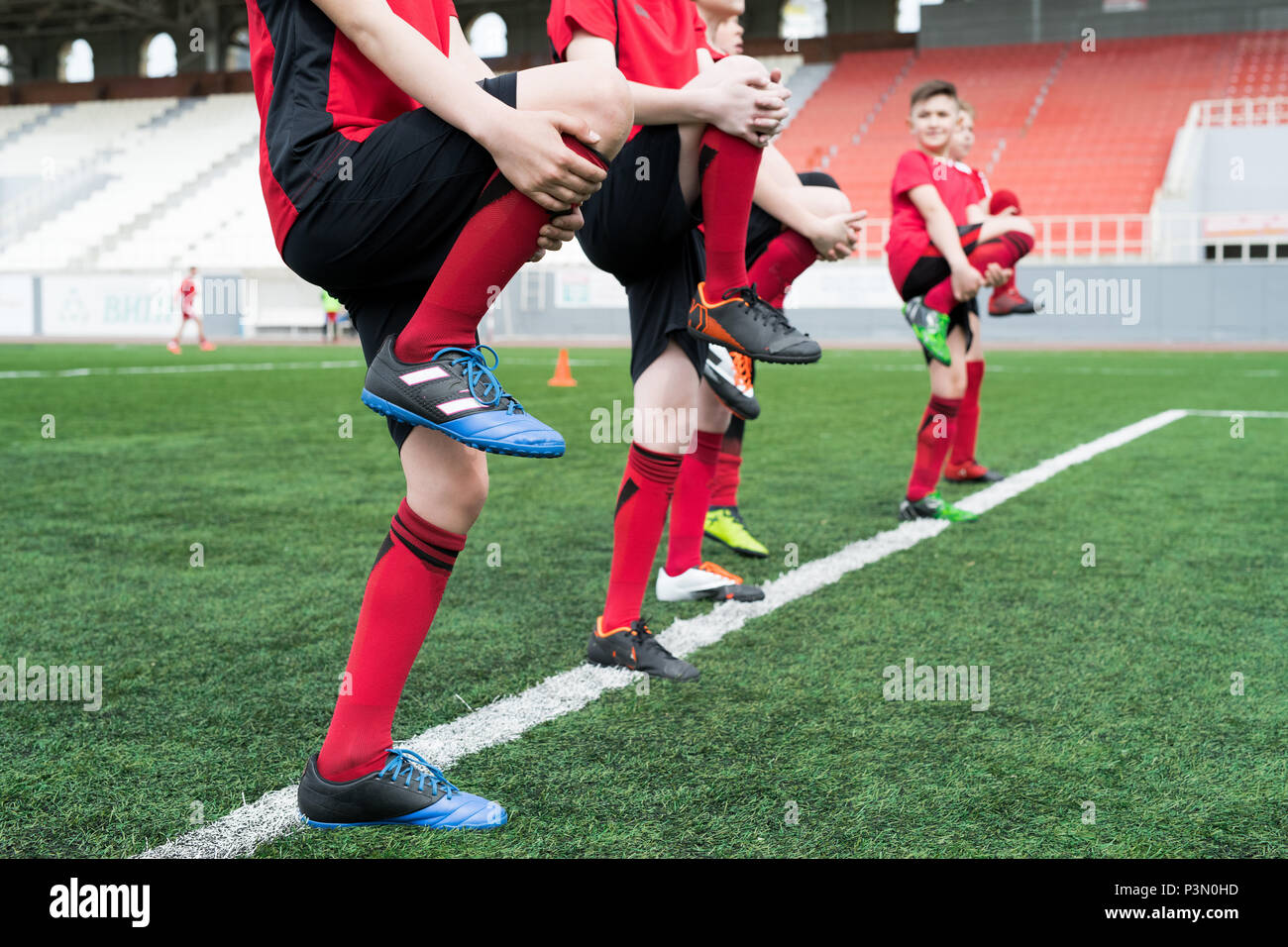 Soccer boy stretching hi-res stock photography and images - Alamy