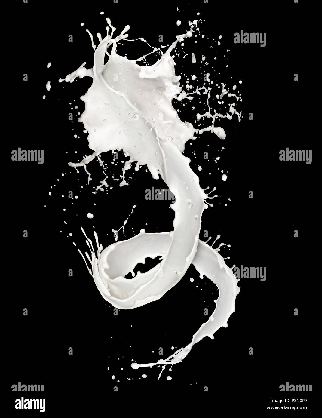 Abstract splash of milk isolated on black background. High resolution ...
