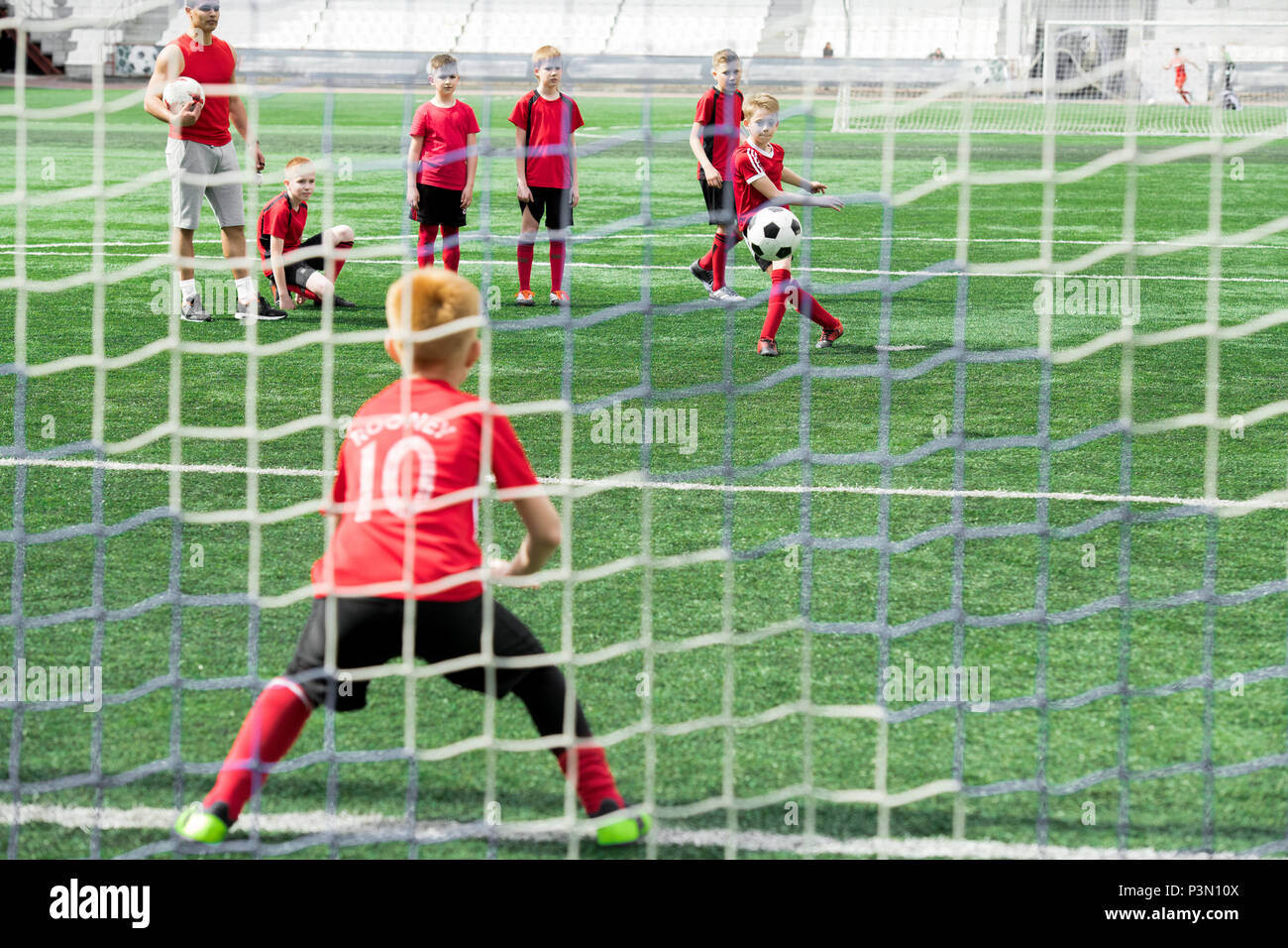 Boy scoring goal hi-res stock photography and images - Alamy
