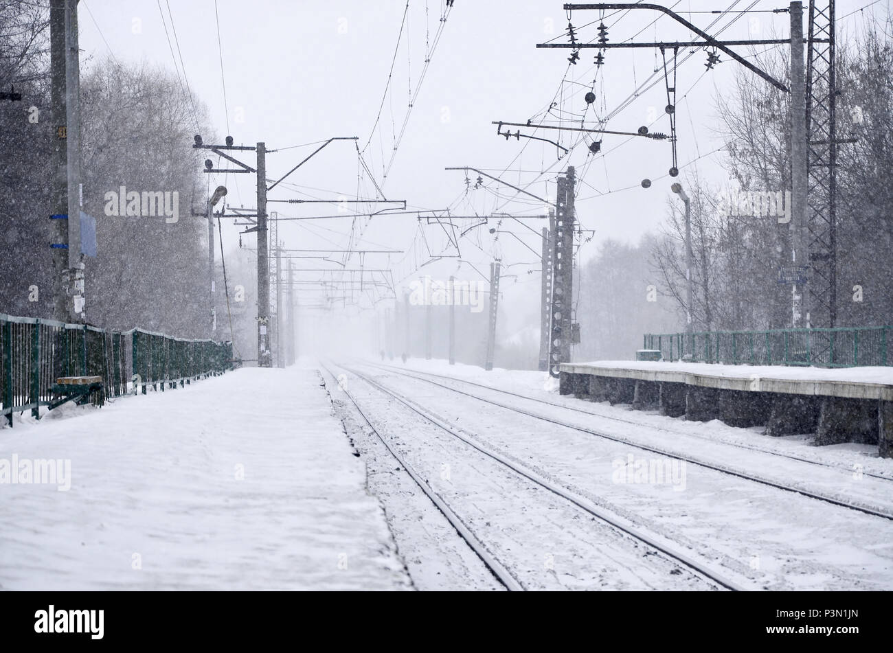 Railway landscape in the cold winter season. Snow-covered railway ...