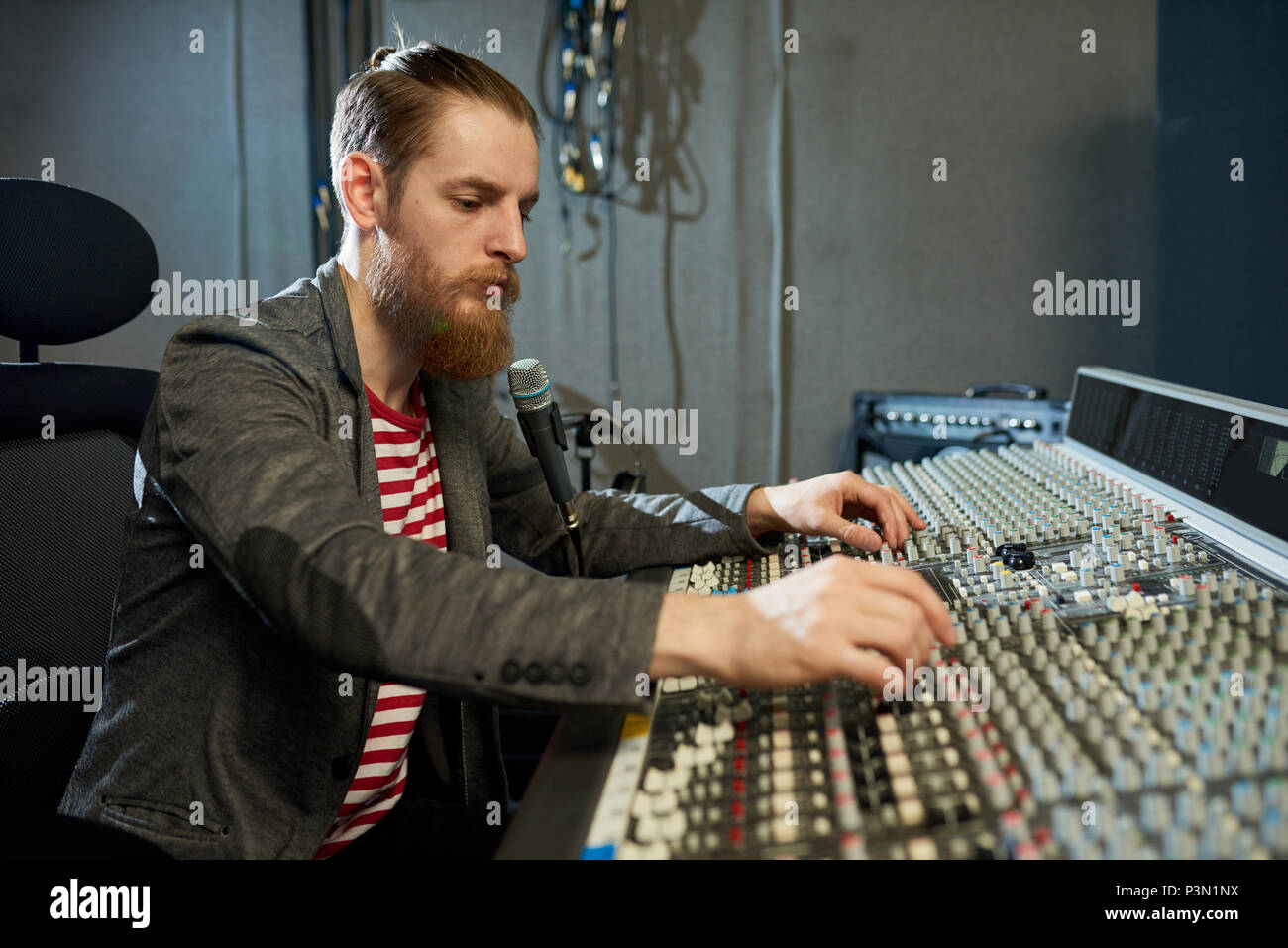 Bearded man in music recording studio Stock Photo - Alamy