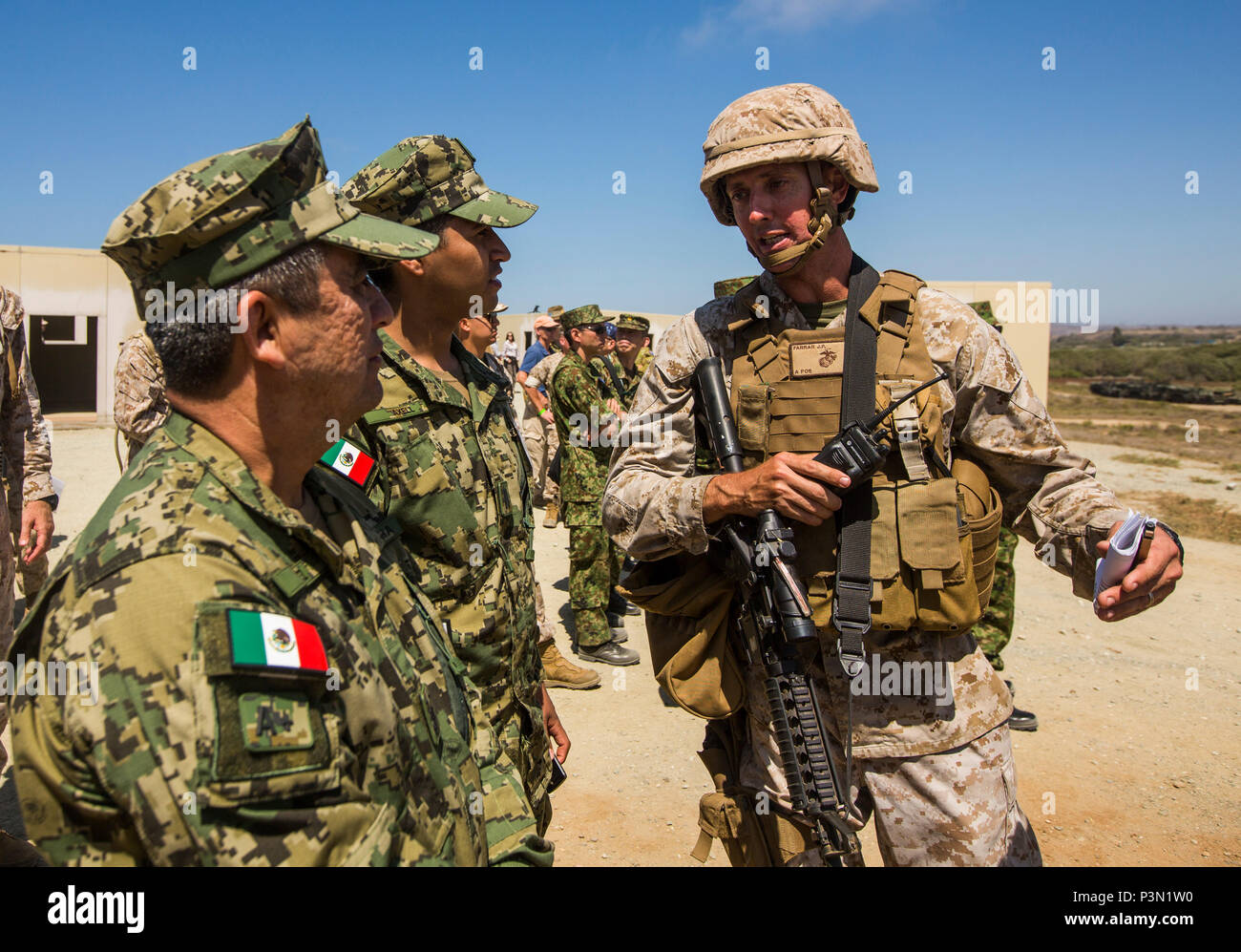 U.S. Marine Corps Capt. Johnathon Farrar, right, company commander of ...