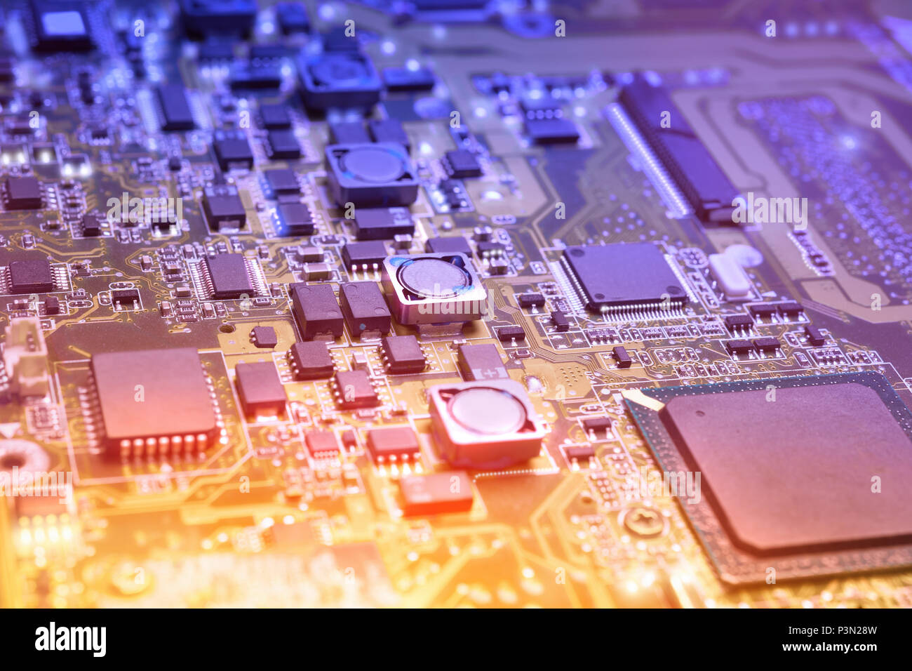 Closeup on electronic board in hardware repair shop, blurred and toned ...