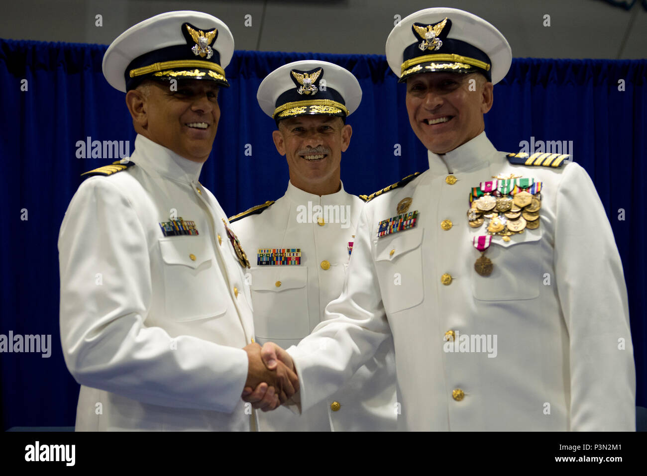 Capt. Michael Davanzo and Capt. Matthew Walker shake hands after Davanzo relieved Walker of ...