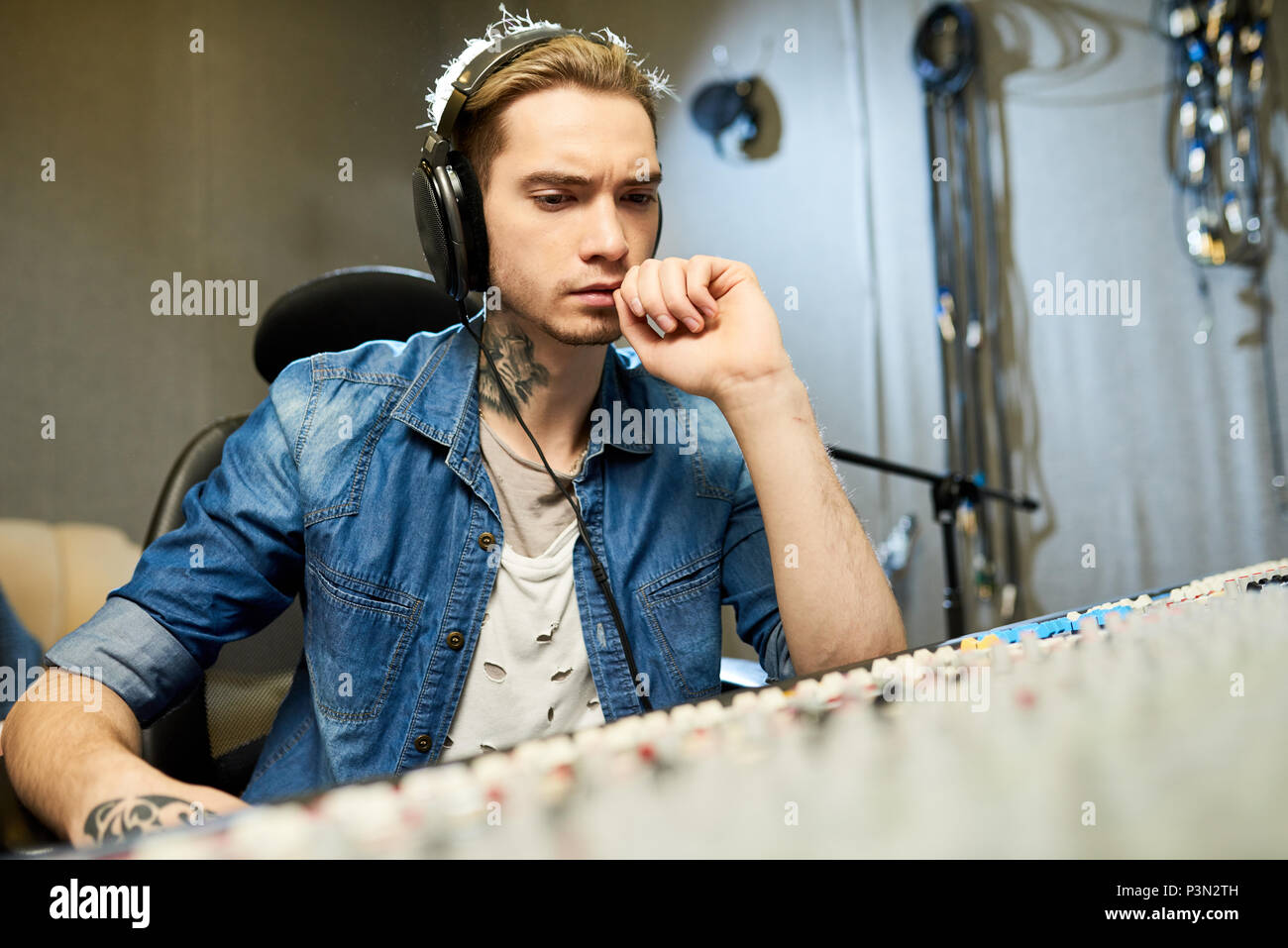 Musician listening to song recording Stock Photo - Alamy