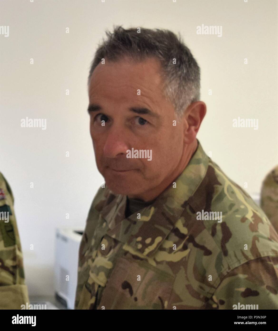 Maj. Neil Bevan, Staff Officer with the British Army, attends a ...